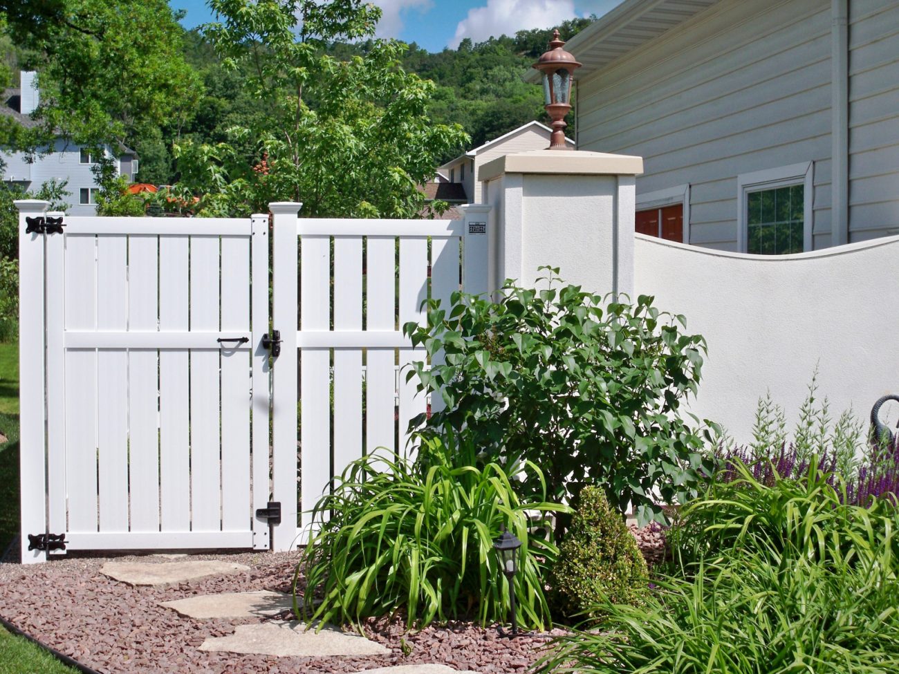 Prestige gate with column and landscaping | Phillips Outdoor Services